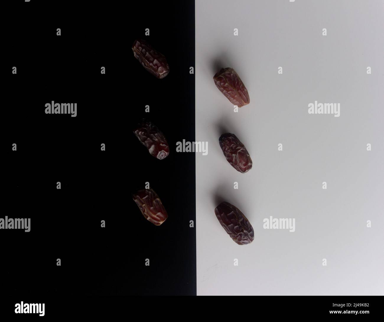 Dates on black and white background, top view of dates Stock Photo - Alamy