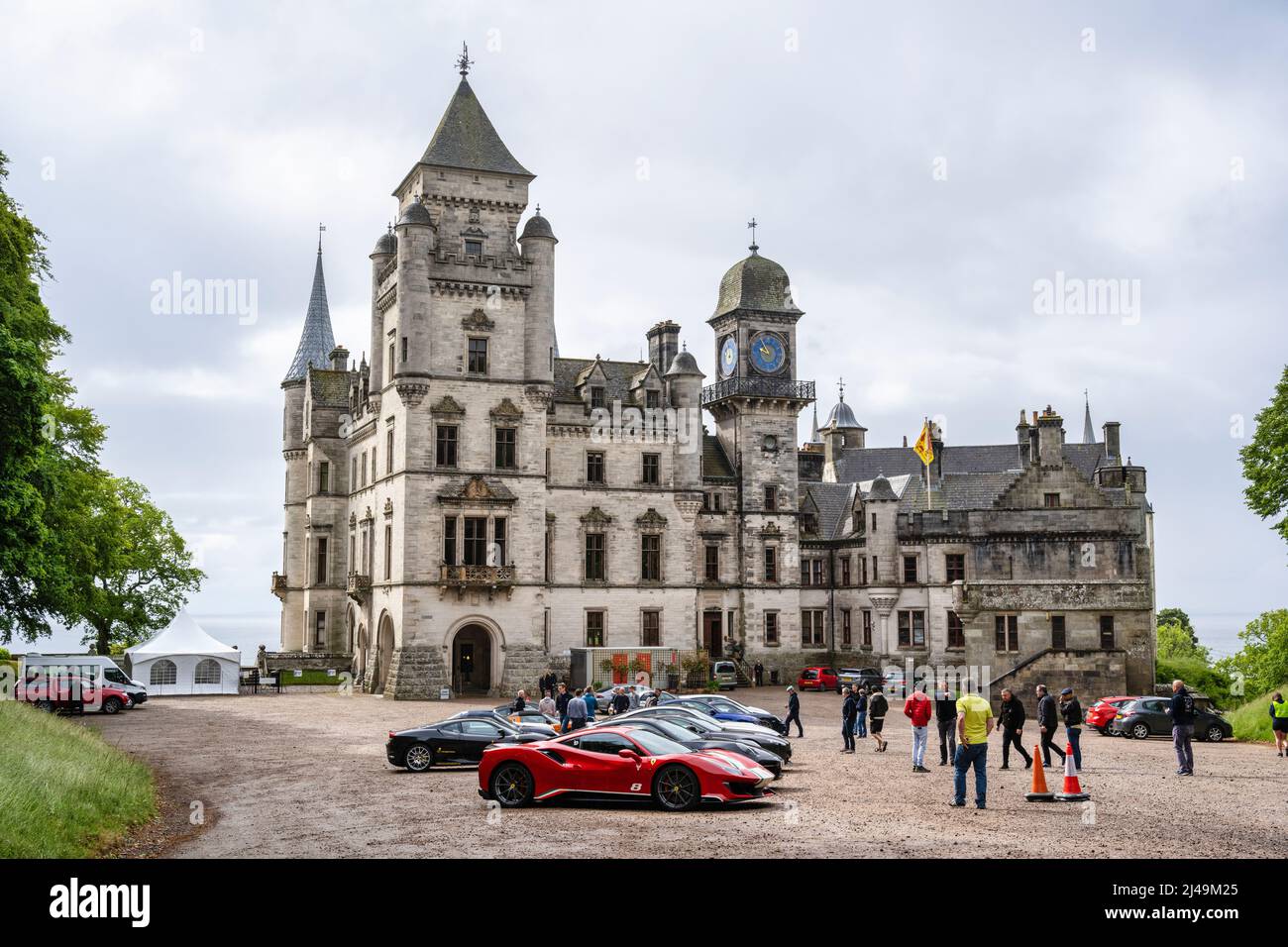 Classic cars parked in front of Dunrobin Castle in Sutherland, Highland ...