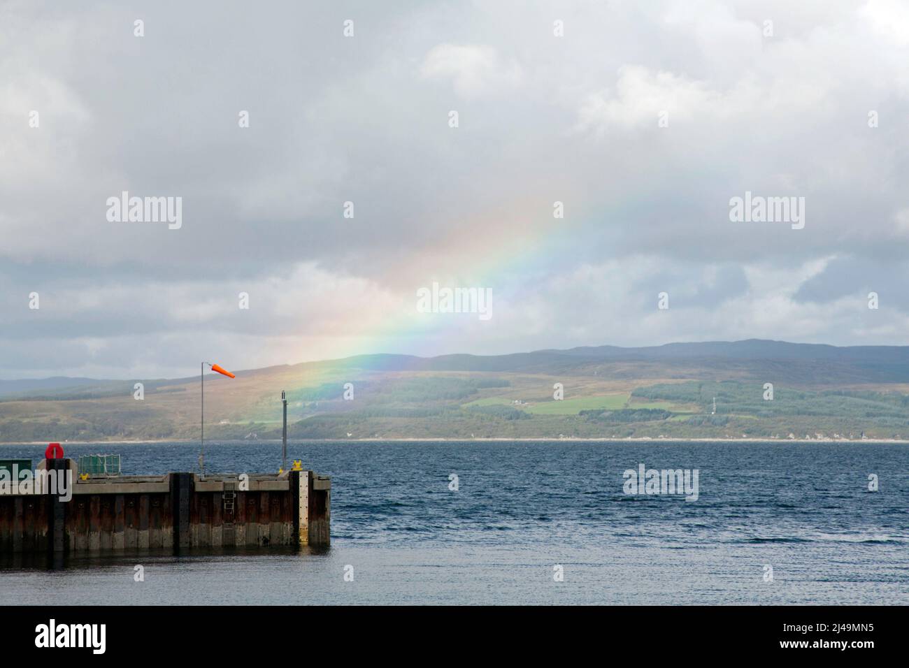 Rainbow shining across the pier at Coillemore Point Loch Ranza Isle of ...
