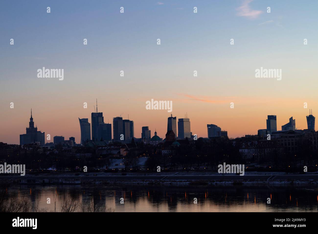 Warsaw by sunset. Cityscrapes, orange yellow sky. Warsaw panorama. No ...