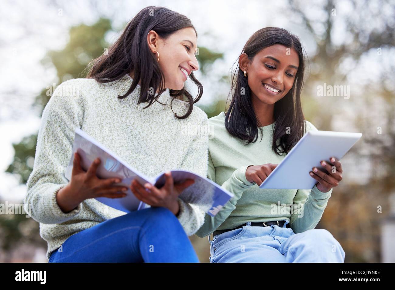 Theres nobody like a study buddy. Shot of two young women studying ...