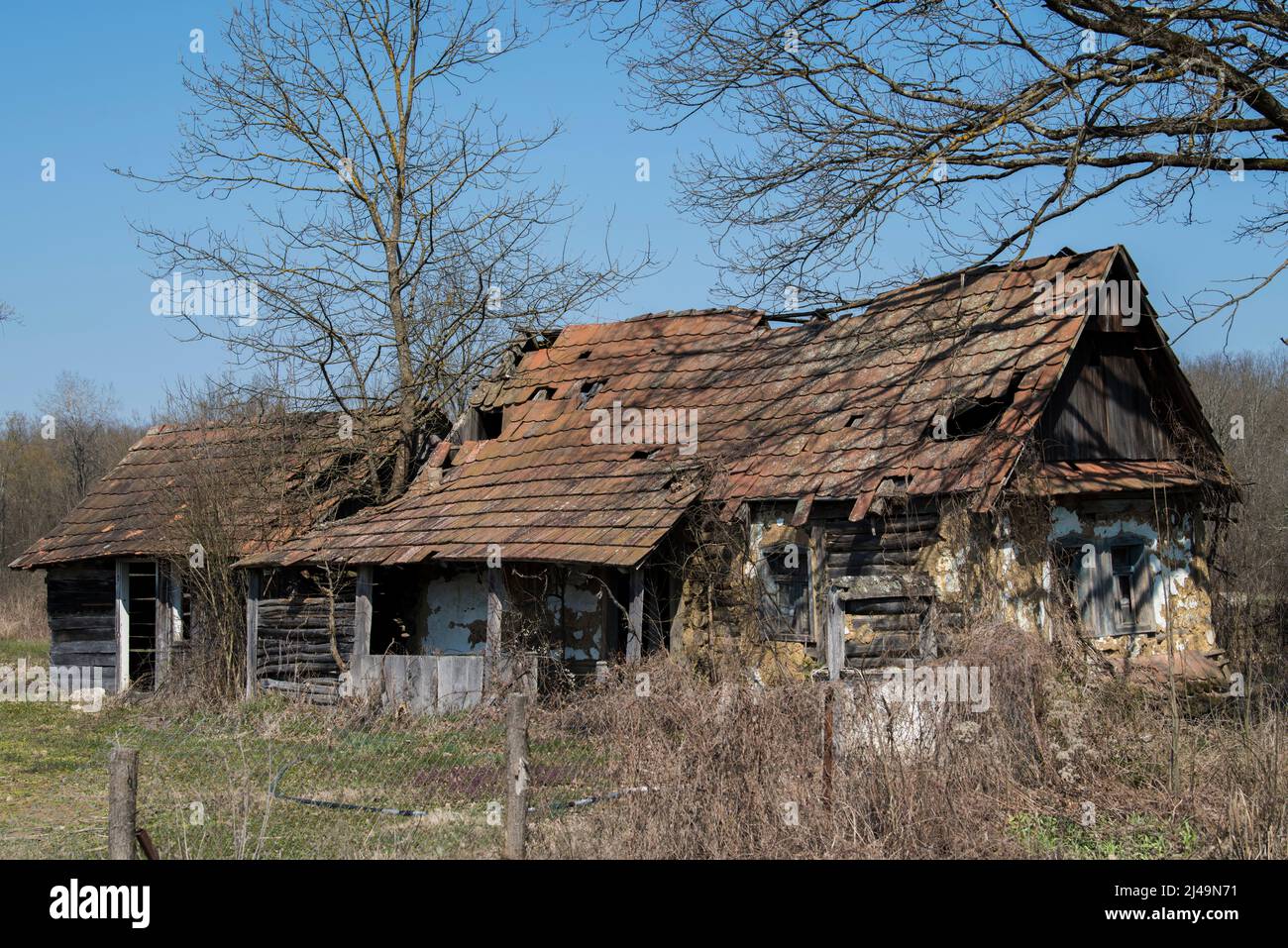 Sunja, Croatia, April 22,2022: Abandoned traditional old wooden house ...