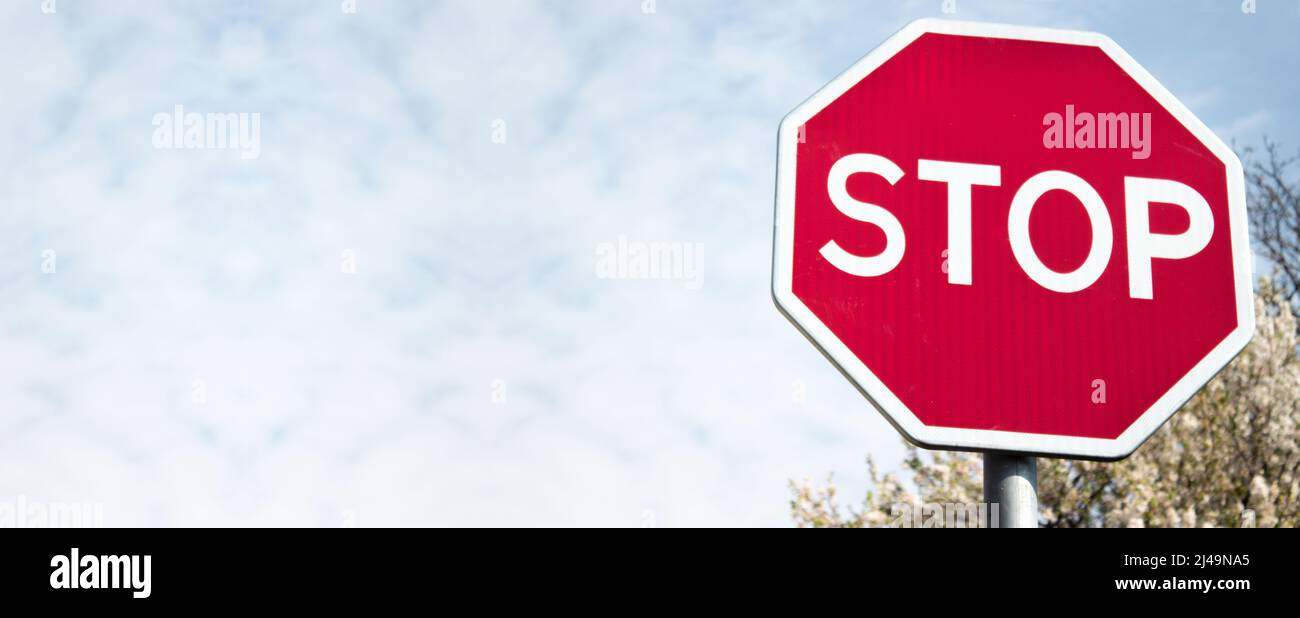 Stop sign against a bright blue sunny summer sky. With space for your ...