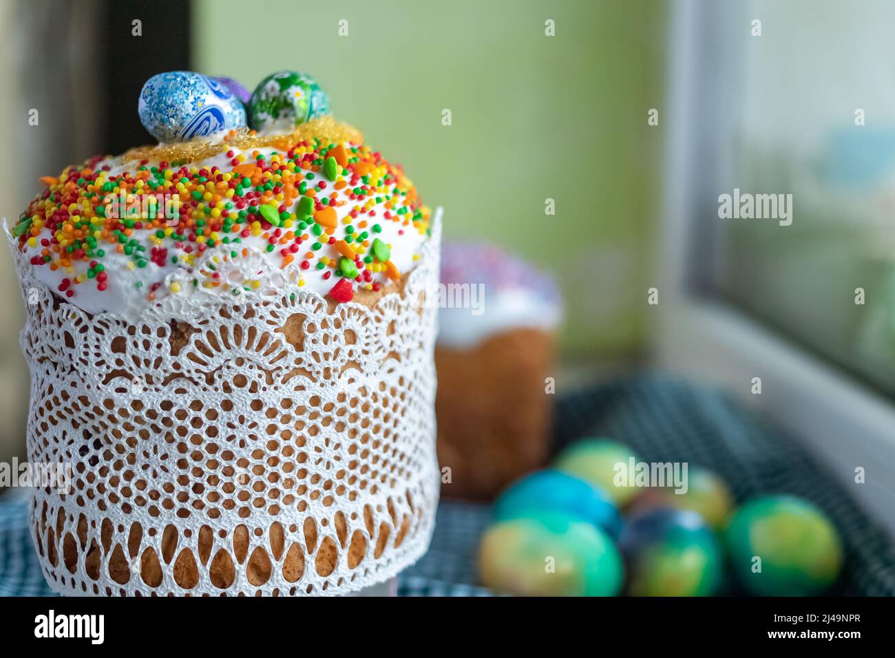 Easter cake with glace icing and decoration. Postcard with Easter bread ...
