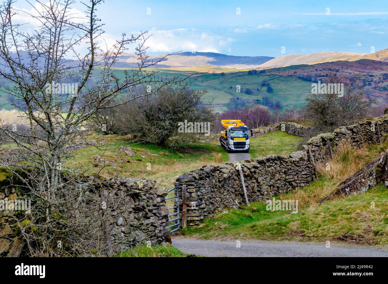 English Lake District landscape with road maintenance vehicle repairing ...