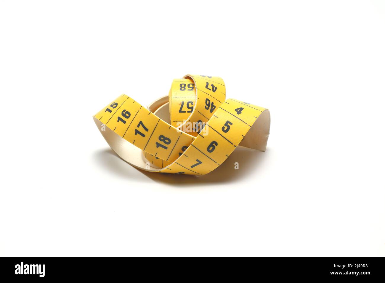 Yellow isolated metric measuring tape isolated on white background ...