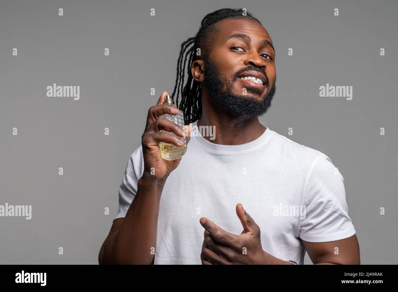 Man spraying cologne hi-res stock photography and images - Alamy