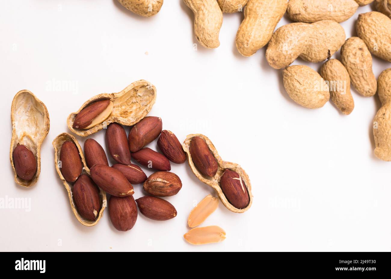 peanut kernels on a white background Stock Photo - Alamy