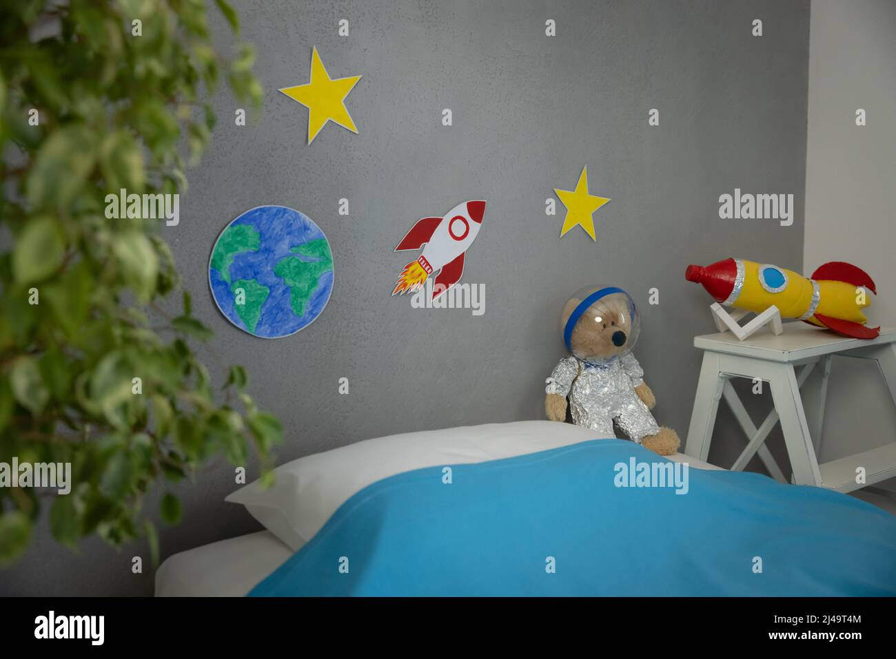 Children's room space interior. Kid pretend to be astronaut Stock Photo ...