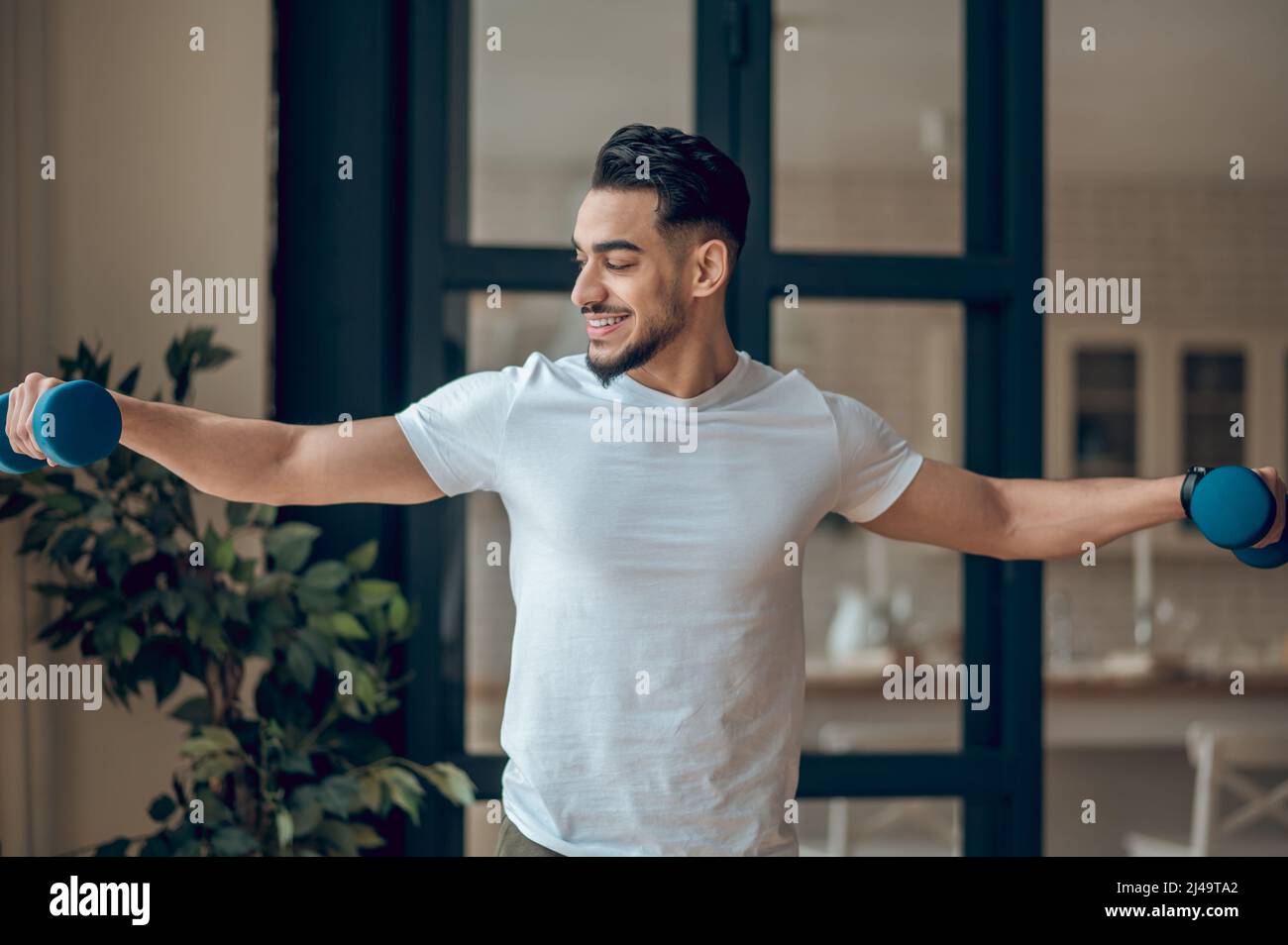 Home gym man dumbbells hi-res stock photography and images - Alamy