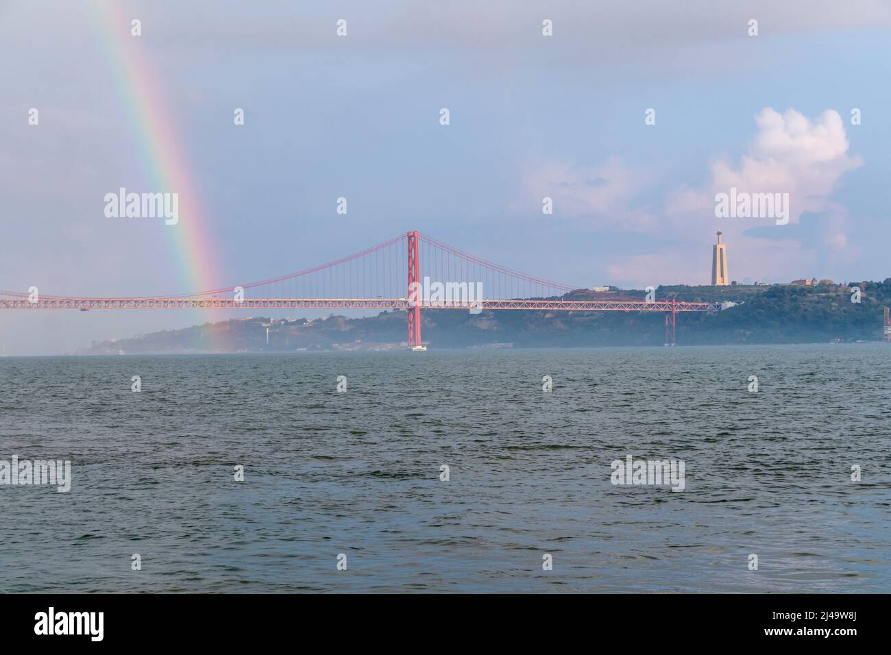 Rainbow and the 25 de Abril Bridge, 25th of April Bridge, a red ...