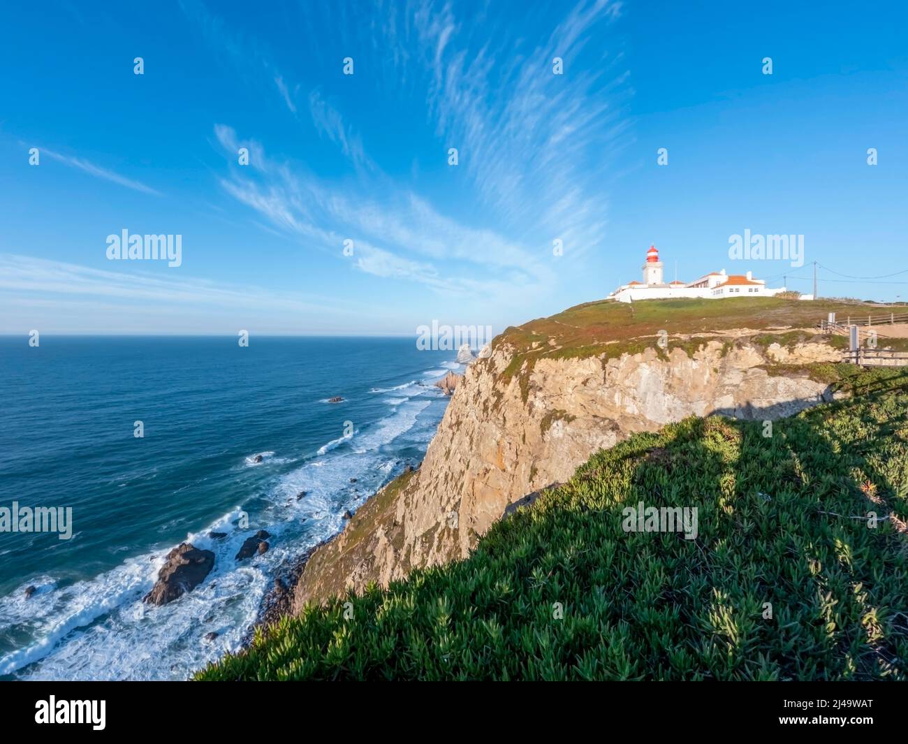 Cabo da Roca cliffs and lighthouse on the coast of the Atlantic ocean ...