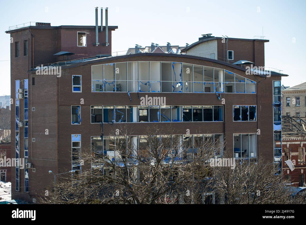 View of a residential building with broken windows. Russian army ...