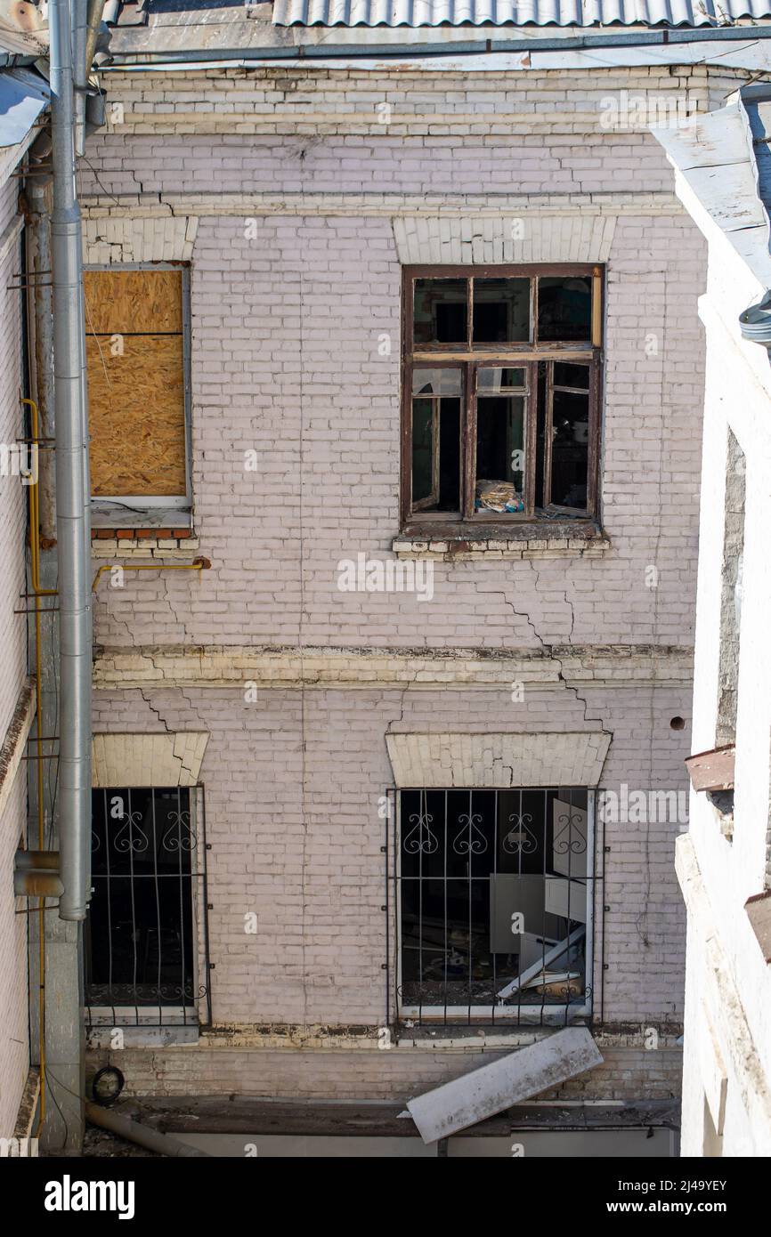 View of a residential building with broken windows. Russian army ...