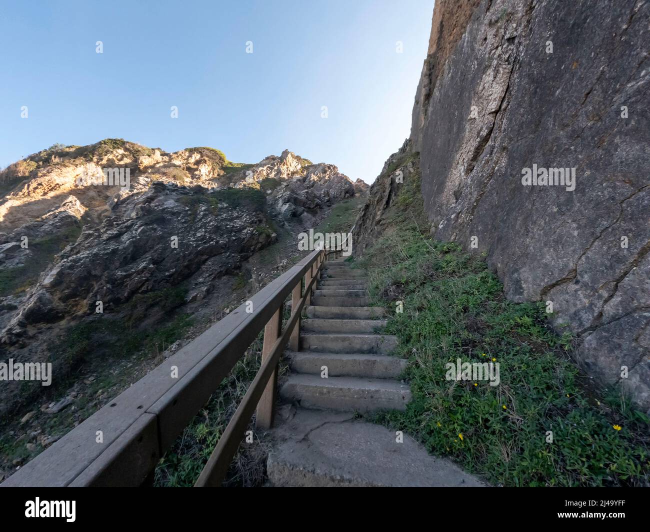 A staircase to the dinosaur footprints on the cliffs of Praia Grande ...
