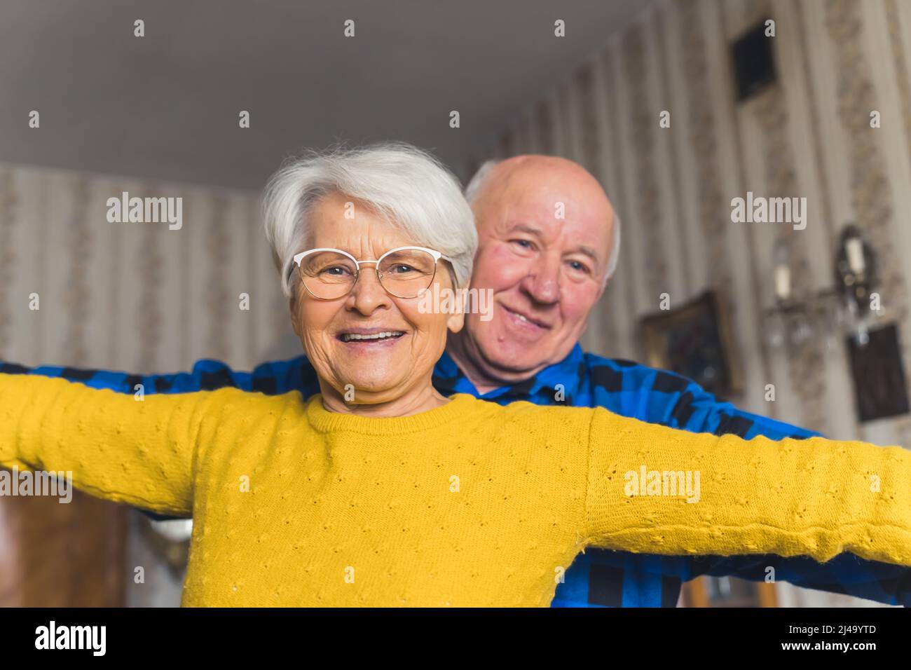 Happy Caucasian Senior Heterosexual Couple Dancing In Their Vintage