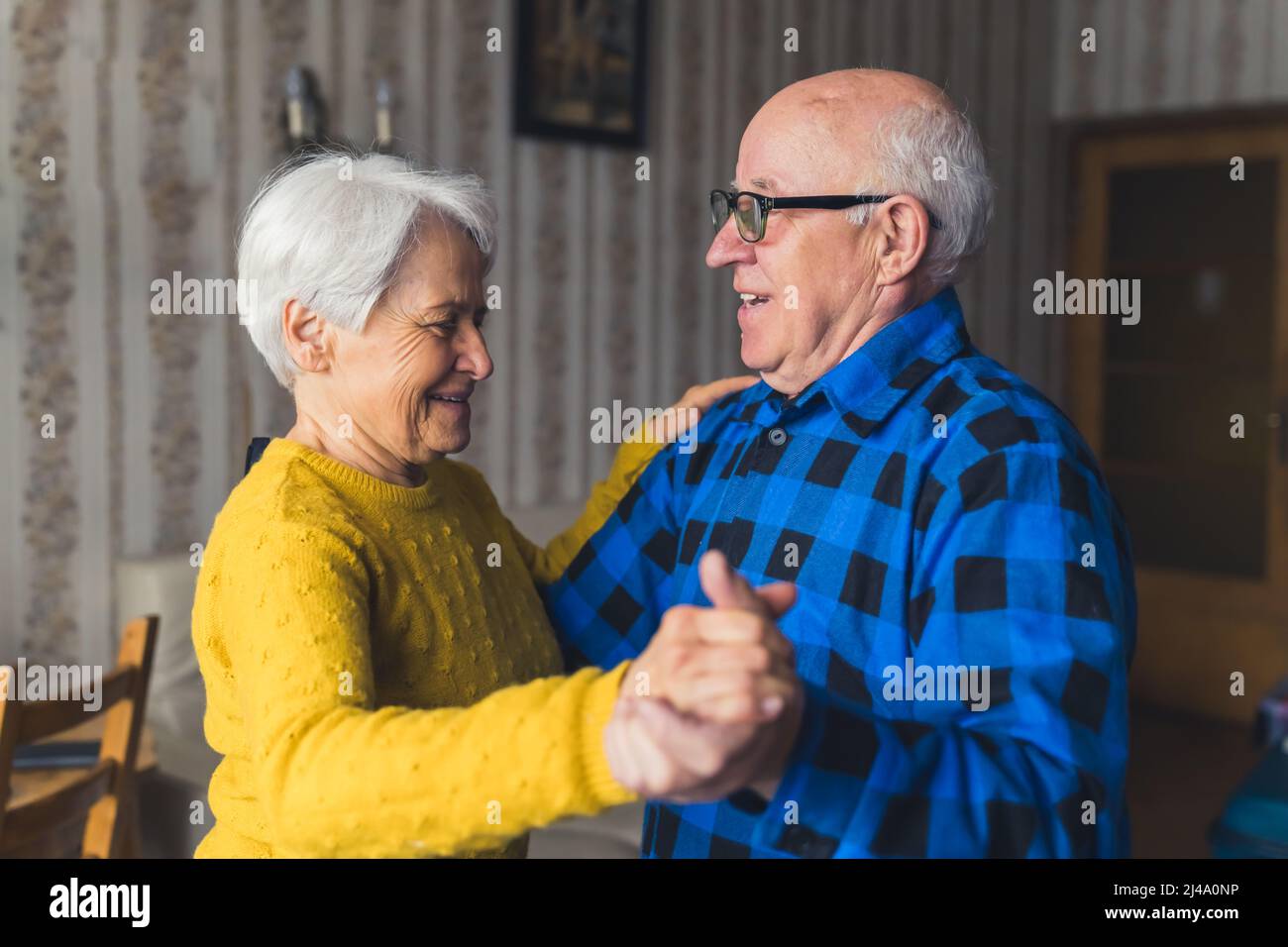 Shared retirement concept. Elderly couple celebrating their anniversary ...