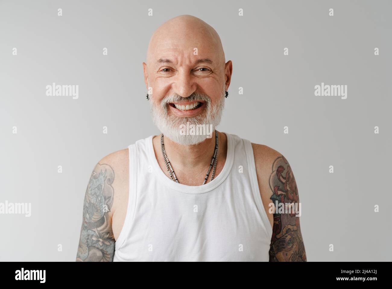 Bald european man with beard laughing and looking at camera isolated ...