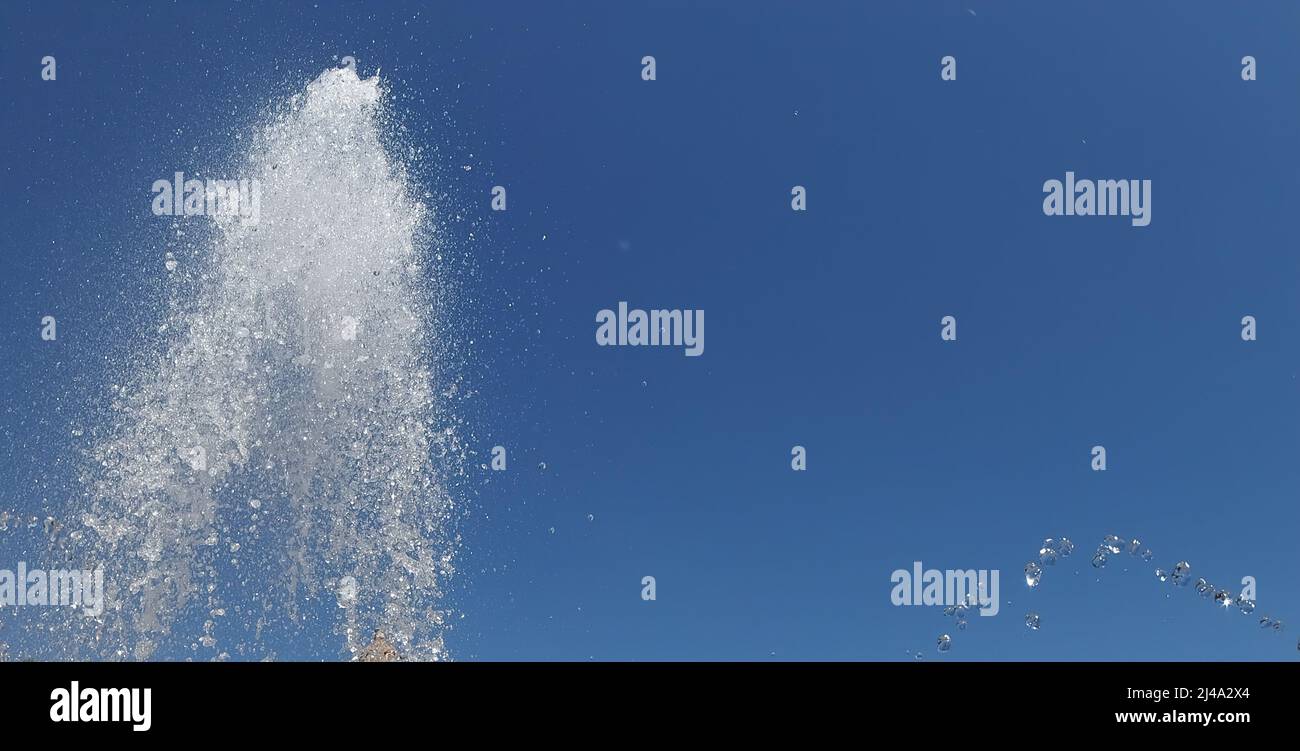 fountain water jet over blue sky background with copy space Stock Photo ...