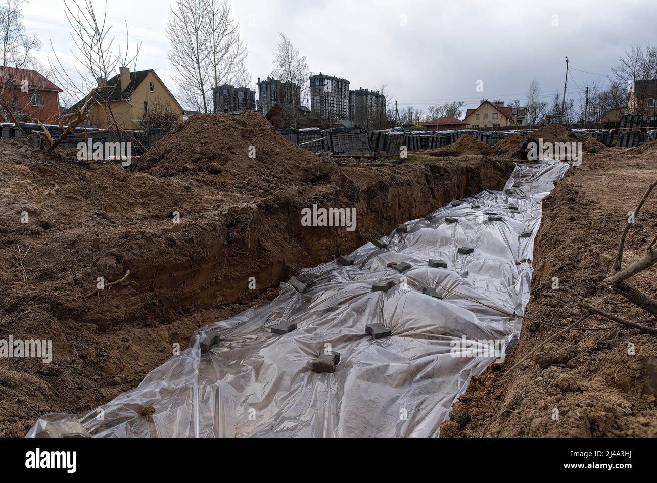 Massive grave behind a church in Bucha, Kyiv Oblast amid Russia's ...