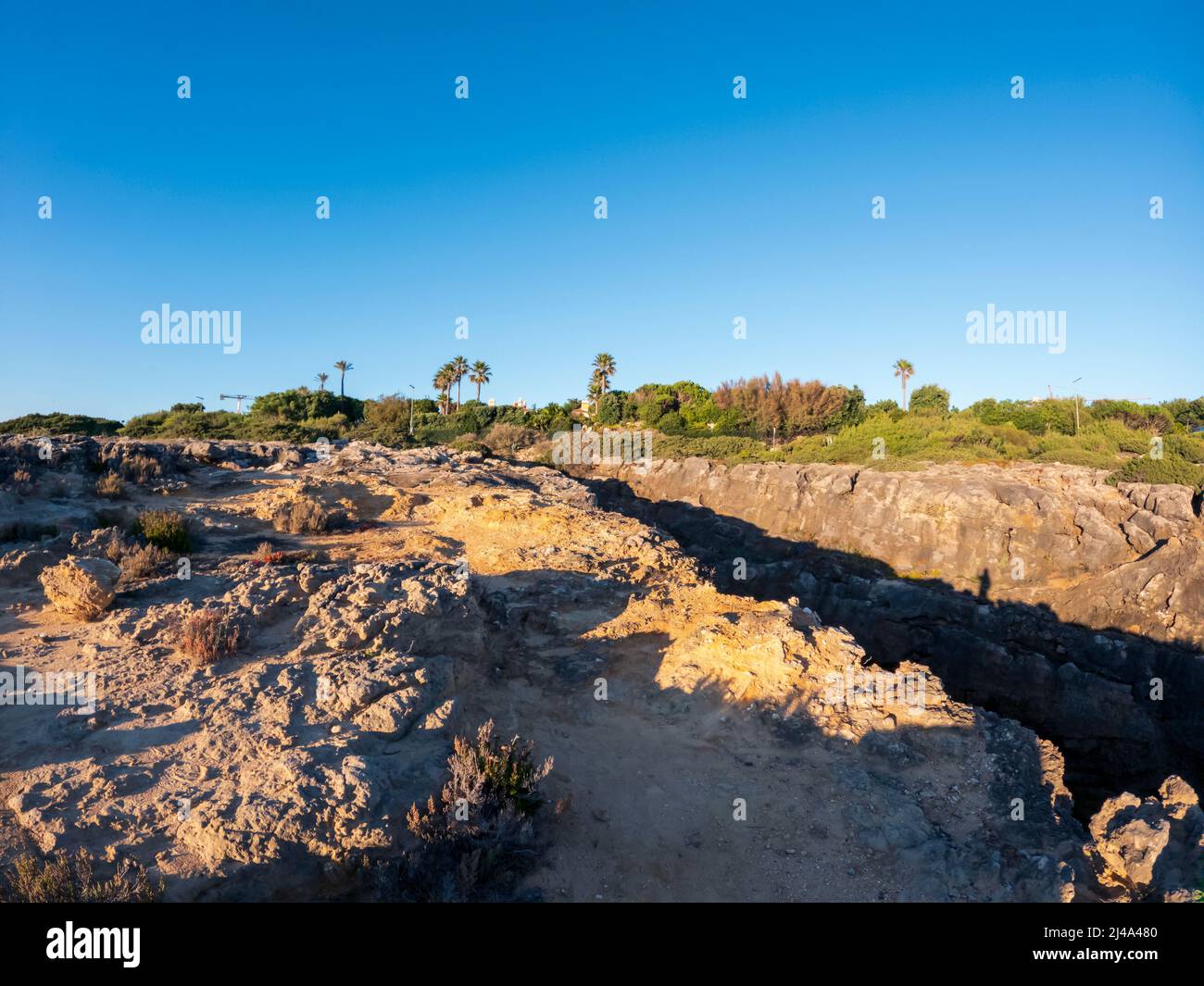 Cabo Raso Lighthouse at sunset golden light, an active Portuguese ...