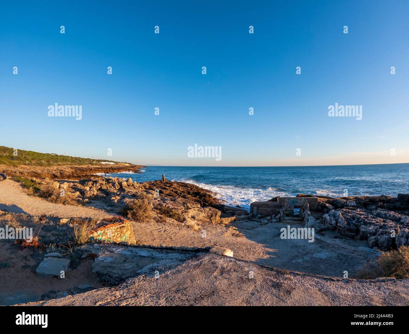 Cabo Raso Lighthouse at sunset golden light, an active Portuguese ...