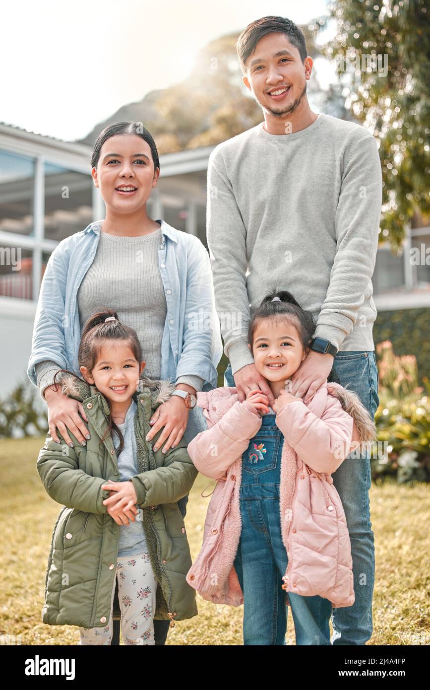 This is my beautiful family. Shot of a young couple and their two ...