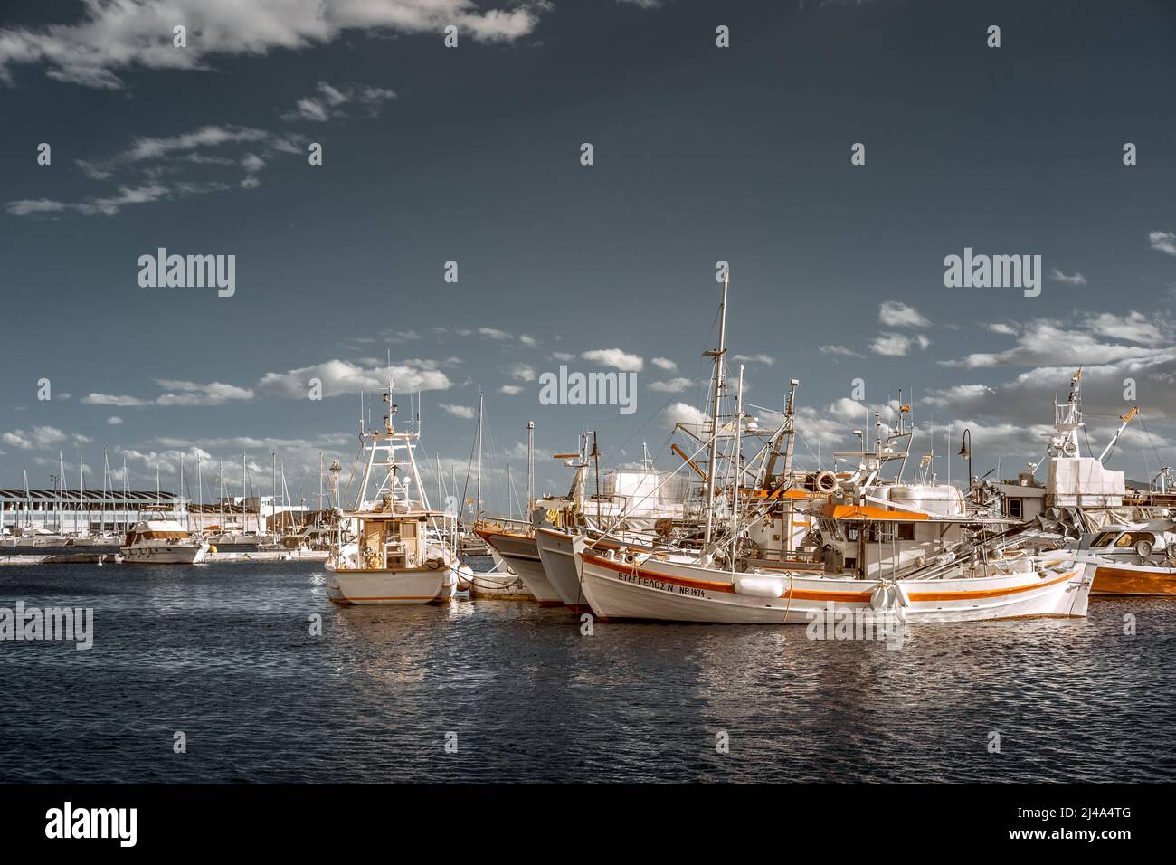 Infrared surreal seascape scenery of fishing vessels in the port of ...
