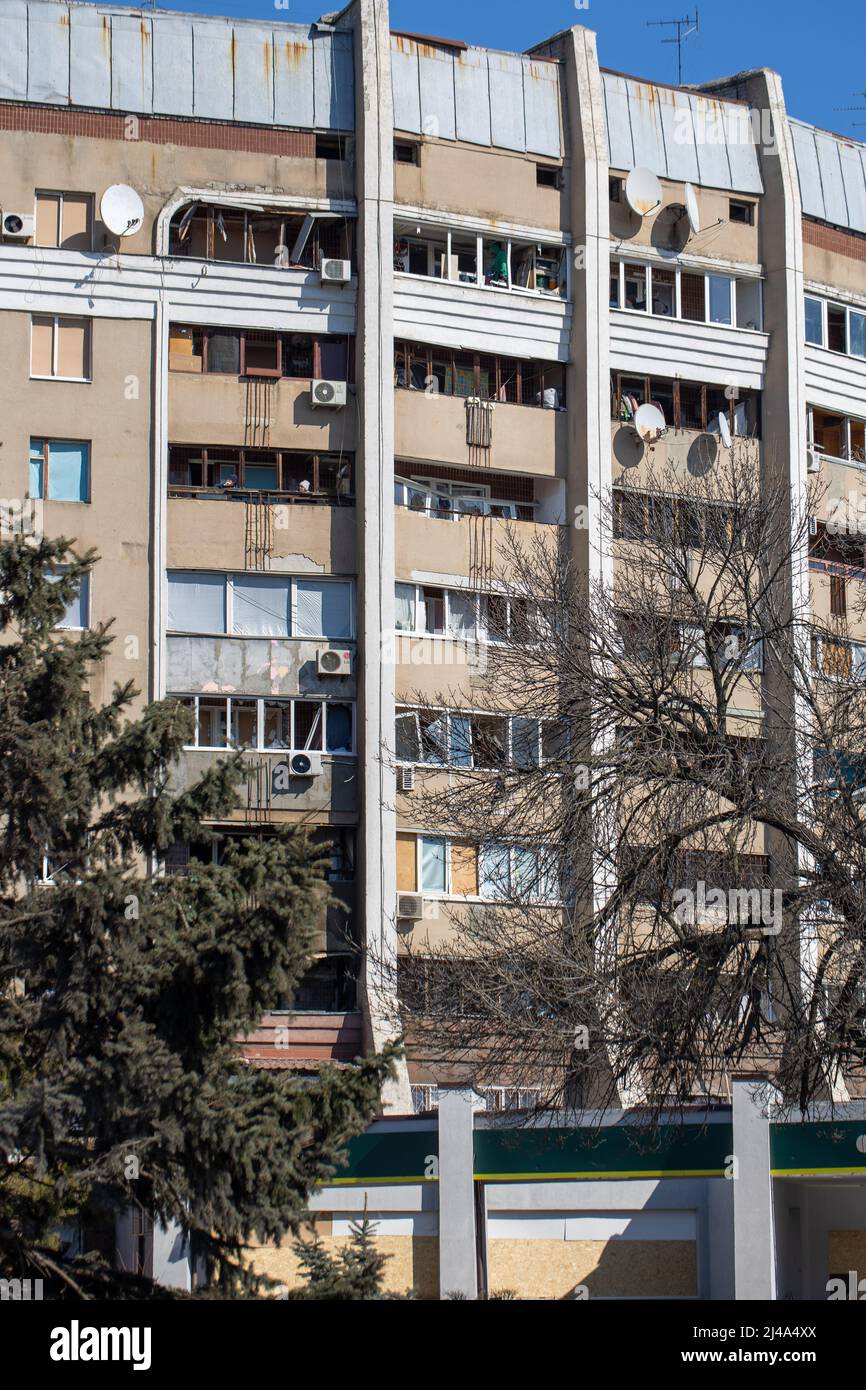 View of a residential building with broken windows. Russian army bombed ...