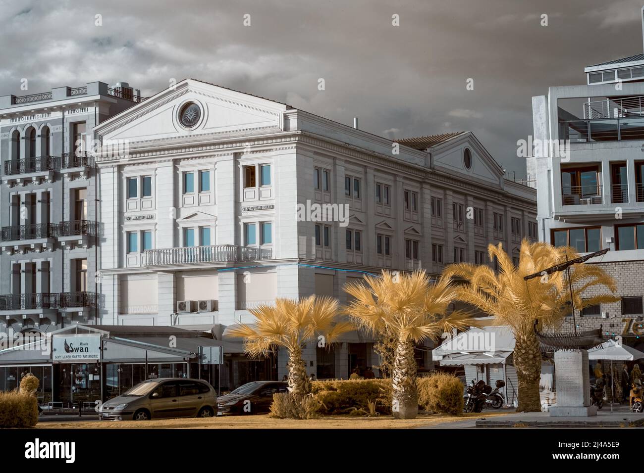 Infrared surreal scenery of beautiful buildings in the city of Volos ...