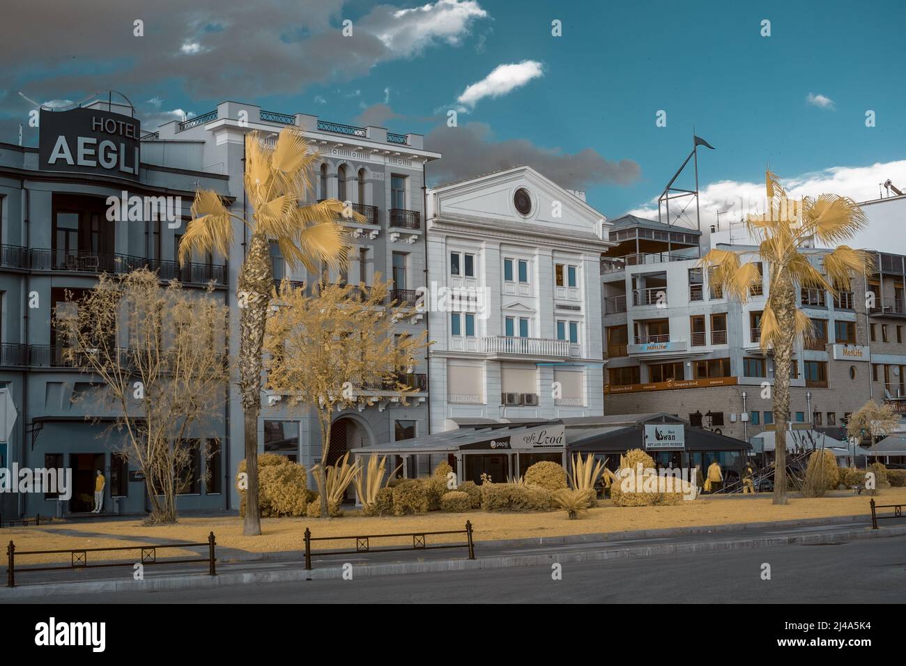 Infrared surreal scenery of beautiful buildings in the city of Volos ...