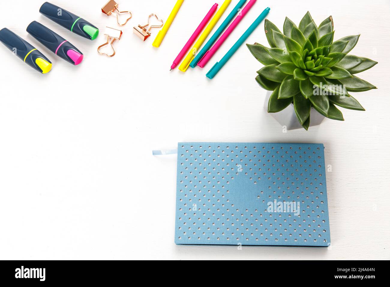 Layout for the office. Back to school. Blue notebook, colorful pens ...
