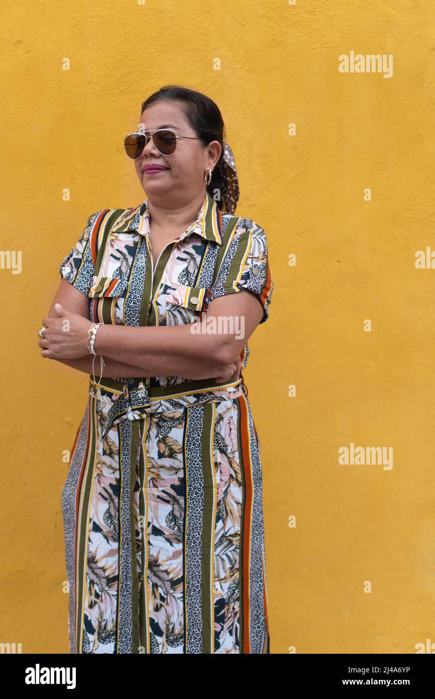 Mature Woman With Her Arms Crossed Looking Away From The Street Stock