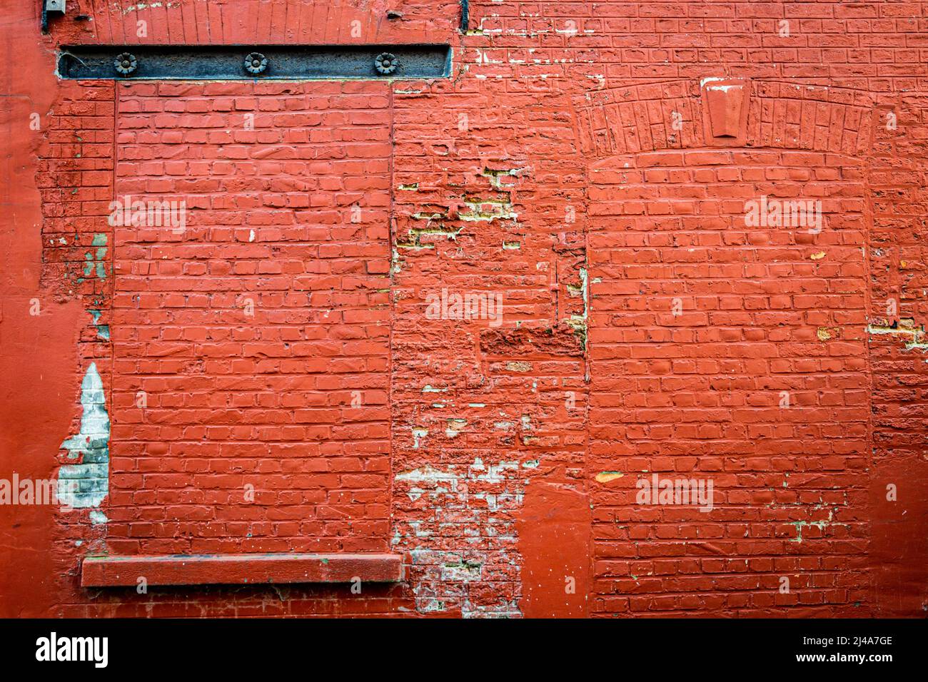 brick wall of a house painted red Stock Photo - Alamy