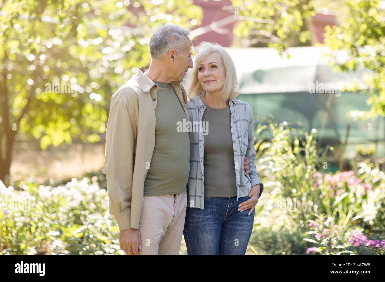 Love and romance in senior age concept. Loving senior spouses embracing ...