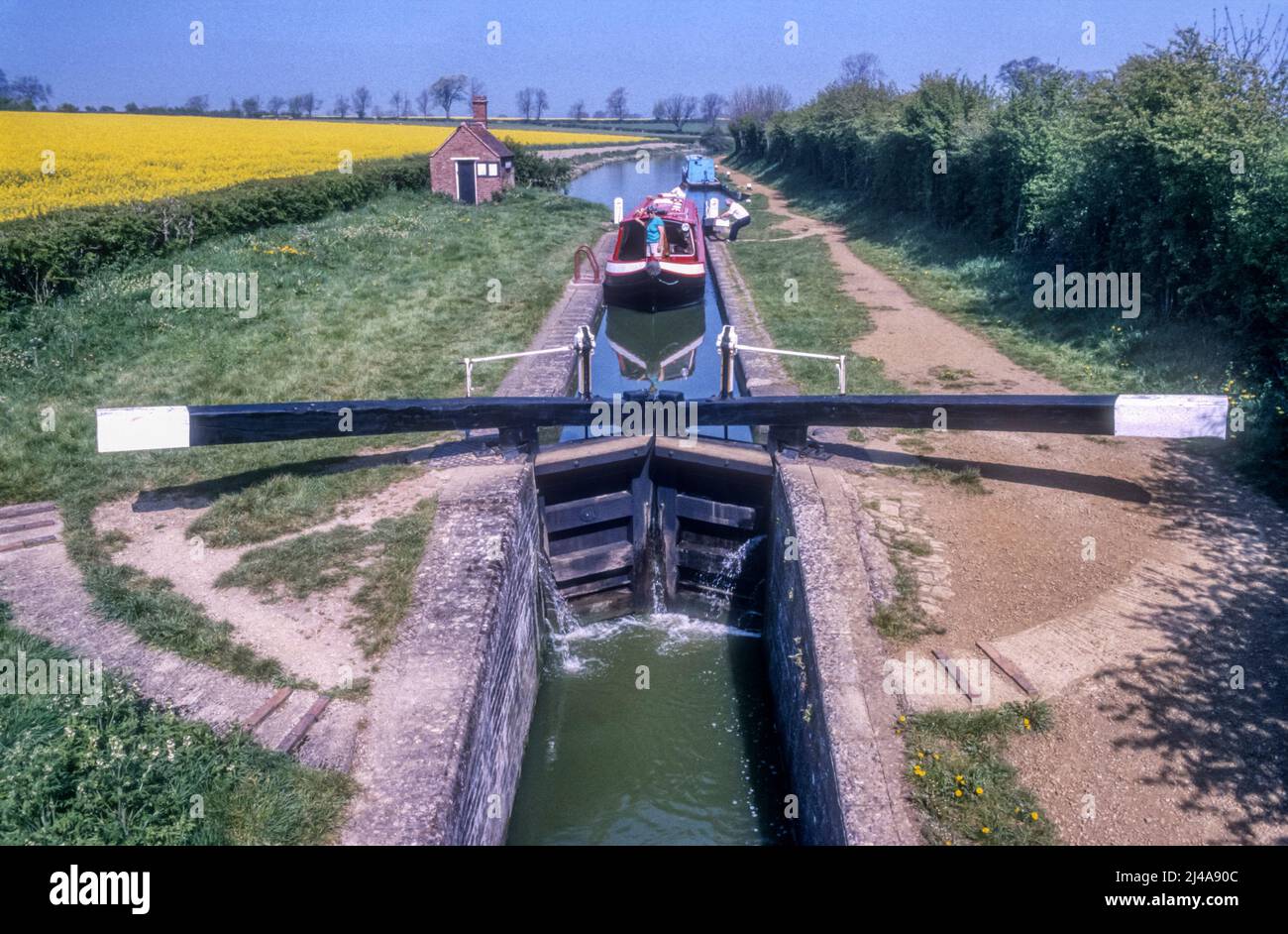 A narrowboat entering Claydon Middle Lock on the Oxford Canal Stock ...