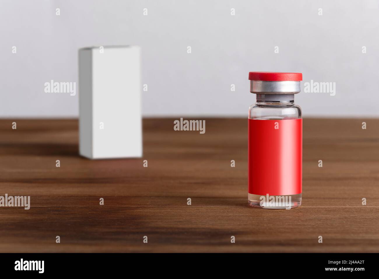 Medical vial for injection on wooden board background. Medicine and ...