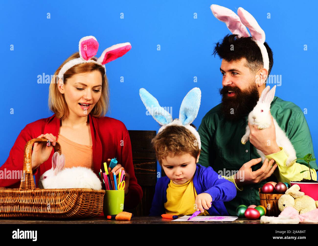 Happy family celebrate easter day at home. Mother, father and son in ...