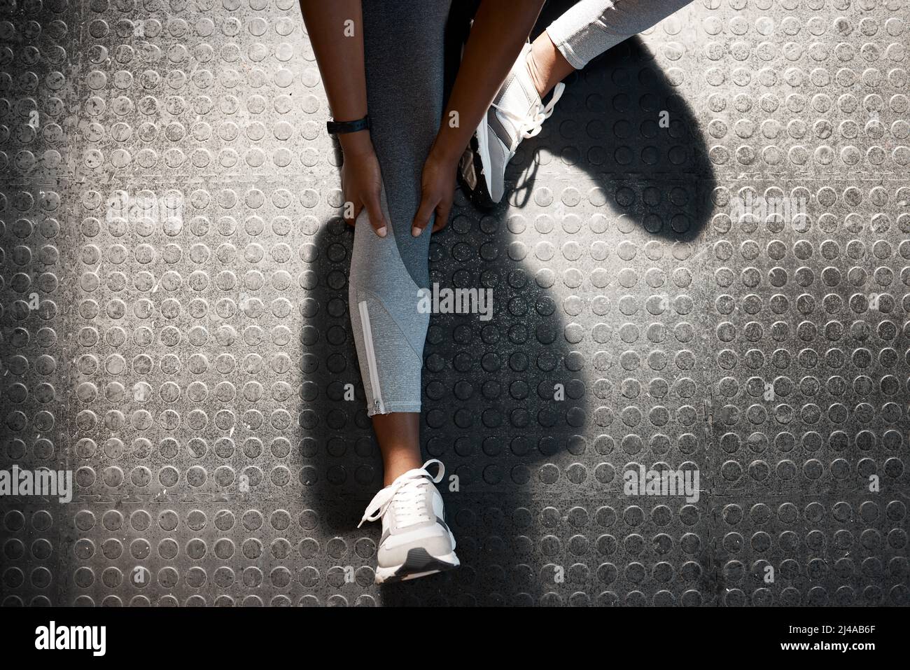 Stretching is an important part of every workout. High angle shot of an ...