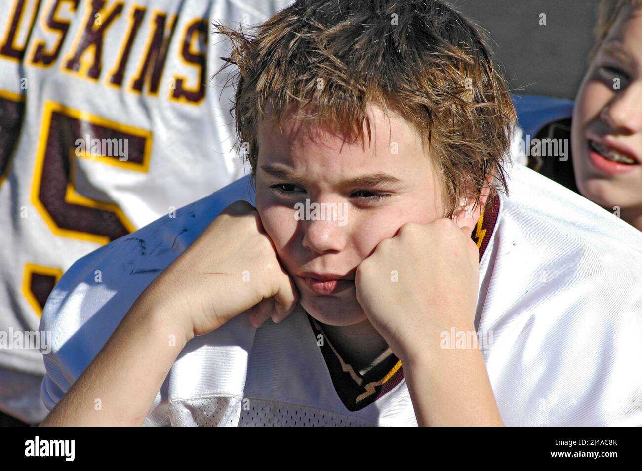 Young football player during loss of game Stock Photo - Alamy