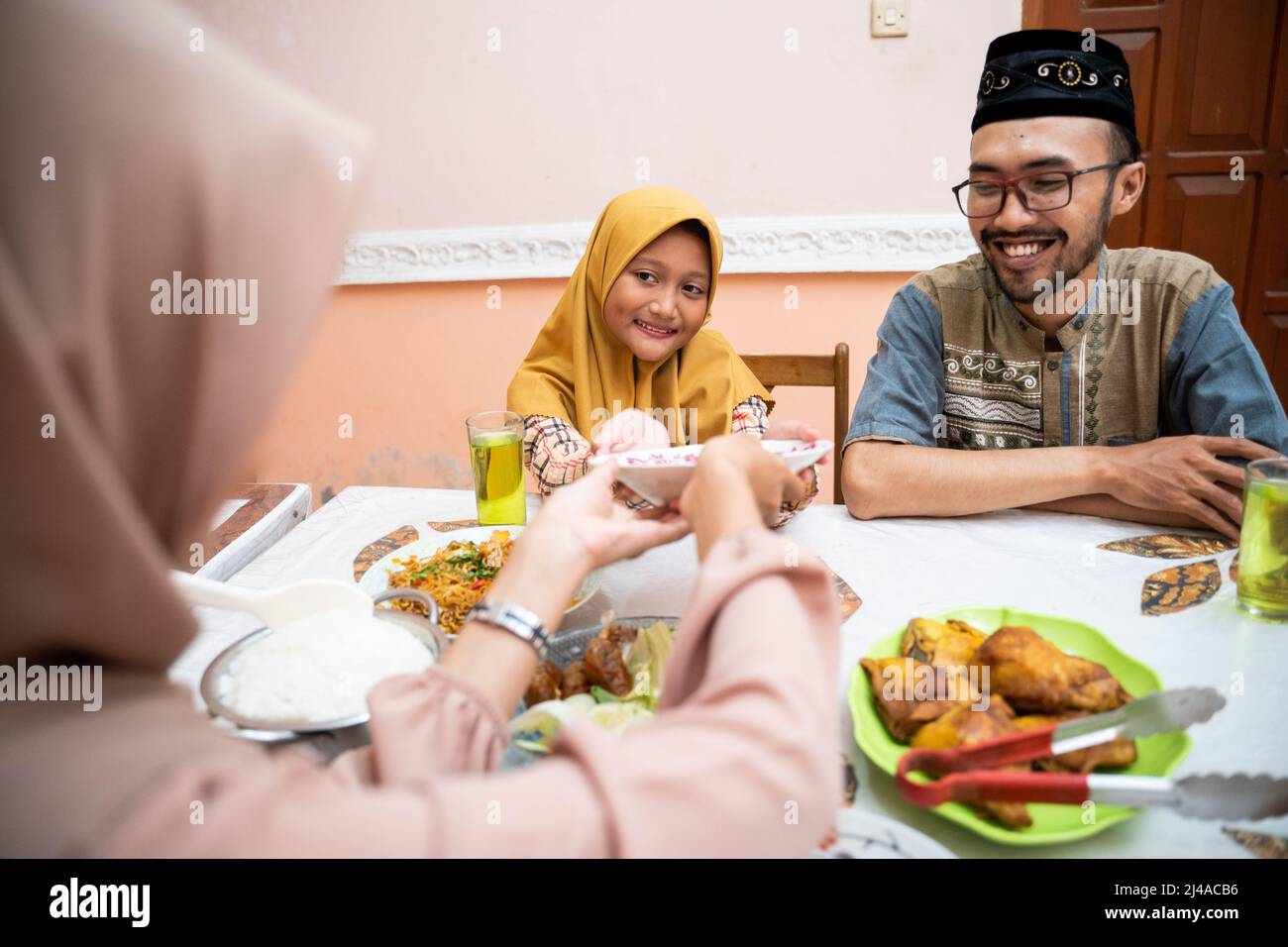 asian muslim eating iftar at their house Stock Photo - Alamy