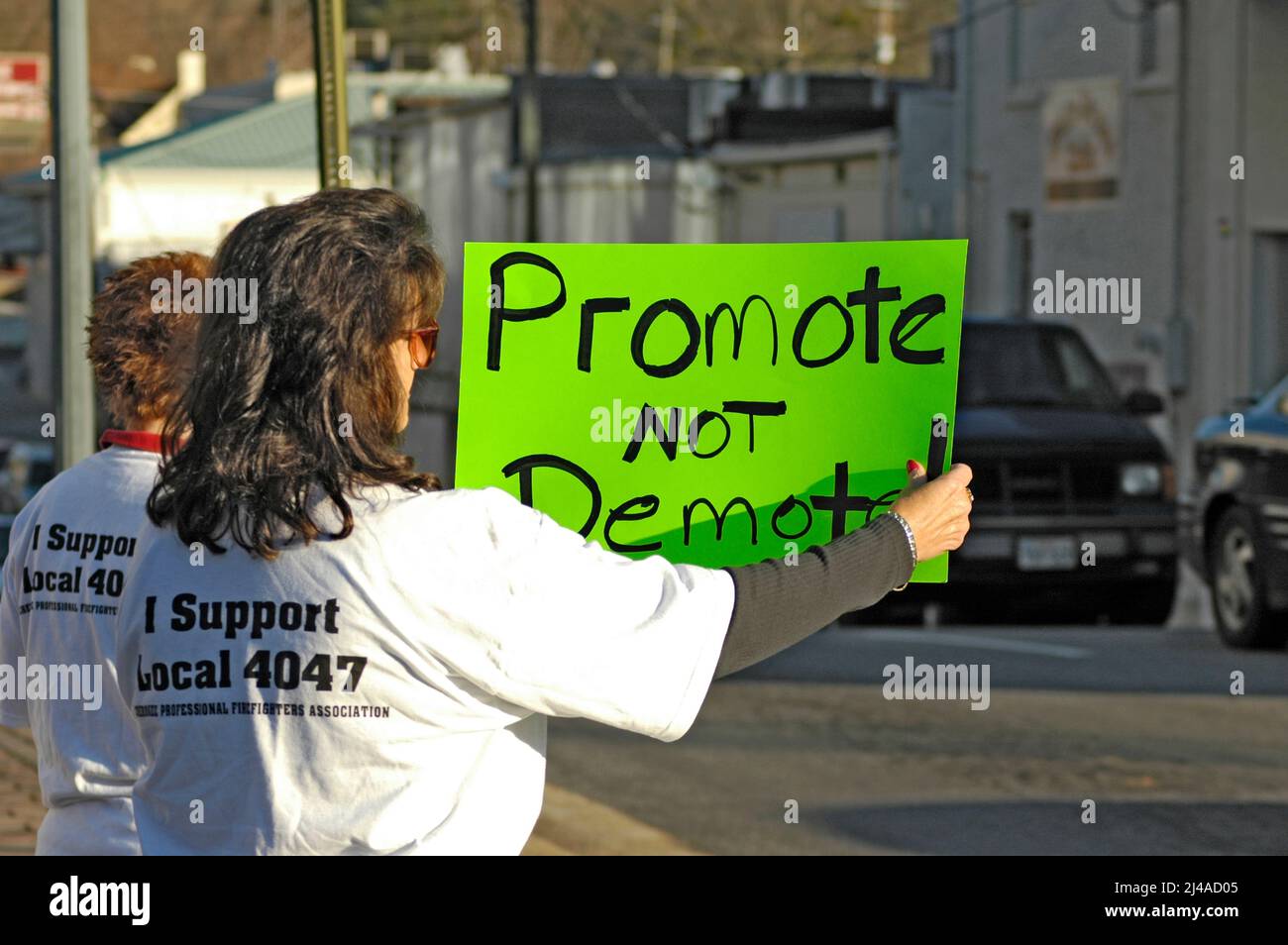 Demonstration of wives and family of public employees being demoted or ...