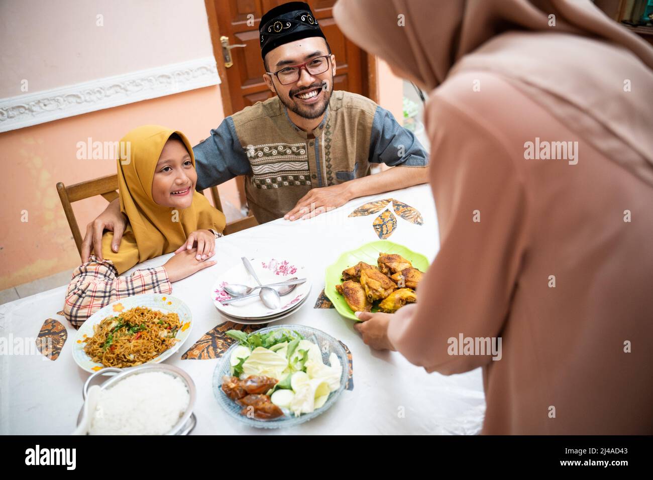 asian muslim eating iftar at their house Stock Photo - Alamy