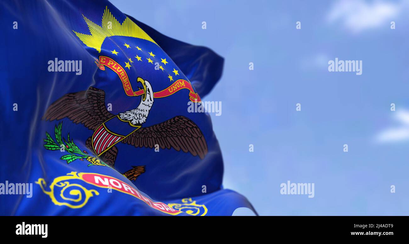 The US state flag of North Dakota waving in the wind. North Dakota is a ...