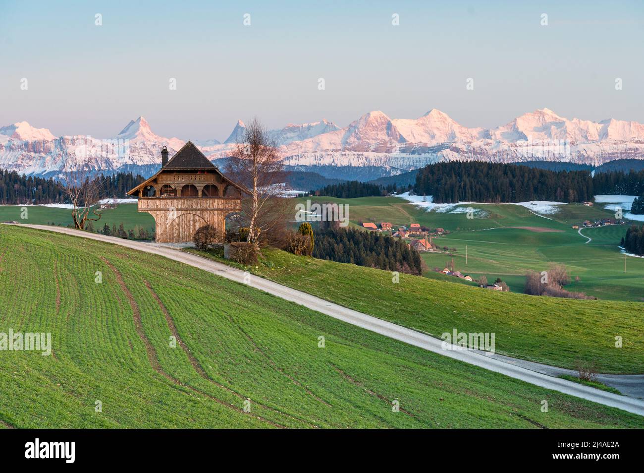 Emmental farmhouse with a view of the Bernese Alps Stock Photo - Alamy