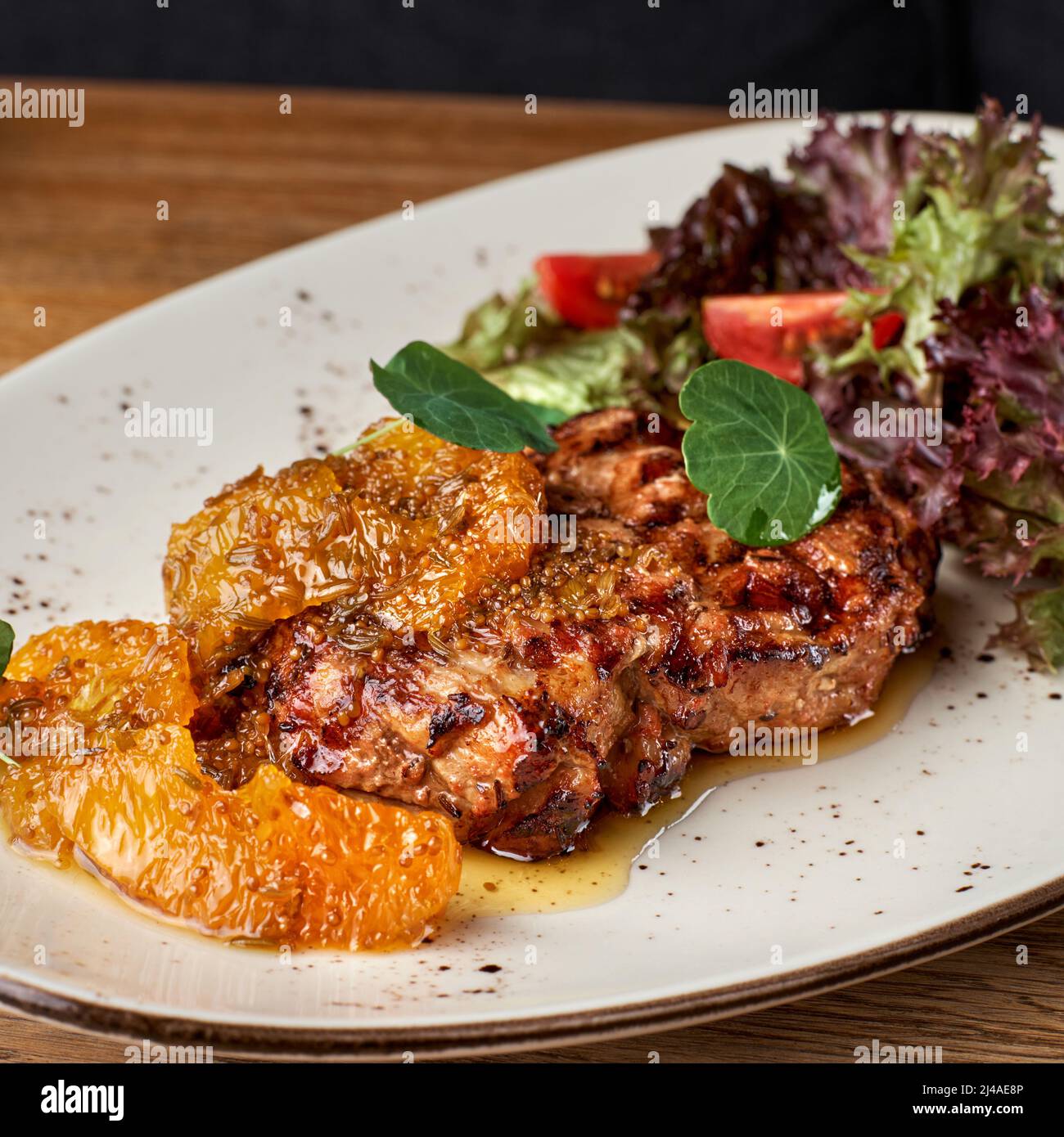 Pork neck with orange mustard and fennel. Pork Neck steak of grilled ...