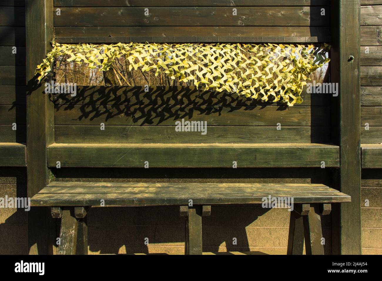 A wooden bird watching hide in a nature reserve in Udine province ...