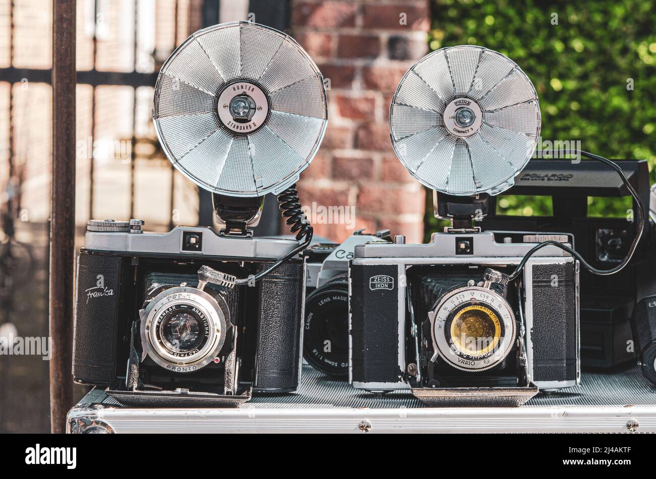 2 retro cameras with big flash Stock Photo - Alamy