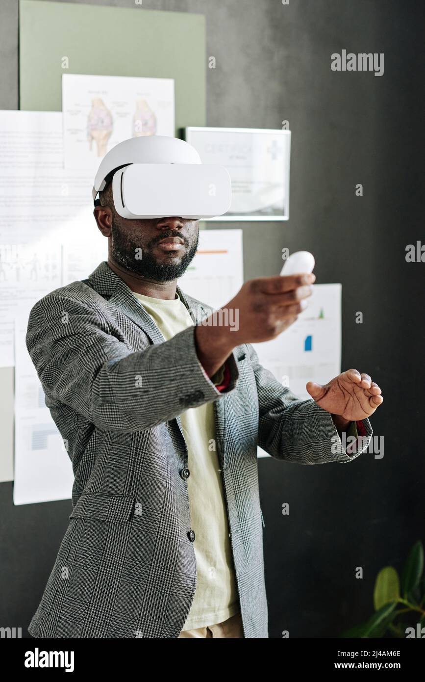 Young african businessman using virtual hi-res stock photography and ...