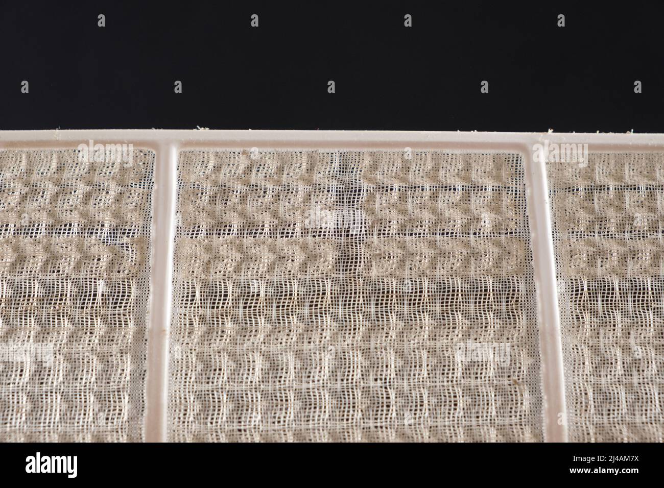 Dusty air conditioner filter. A lot of dust on the net, asthma and ...